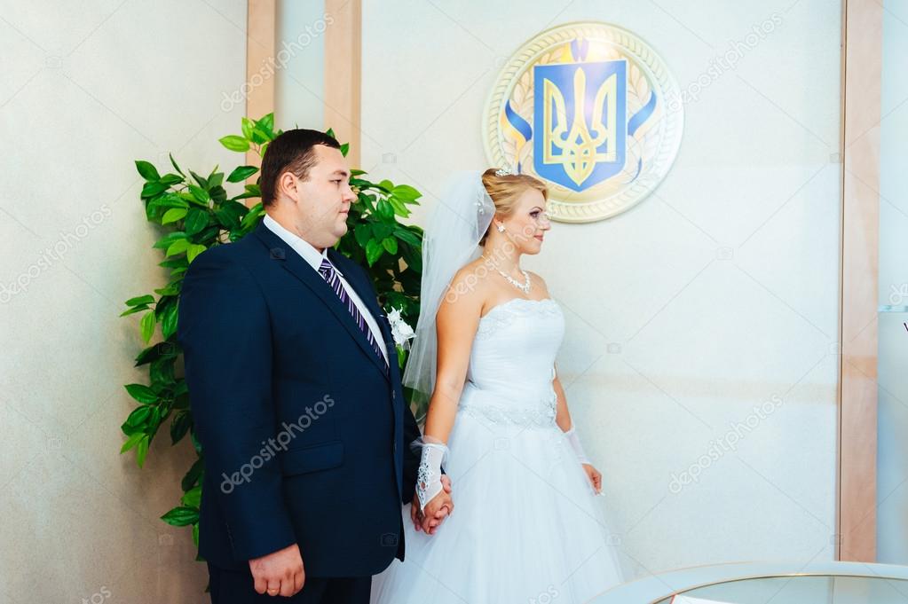 Wedding ceremony. Registry office. A newly-married couple signs the ...