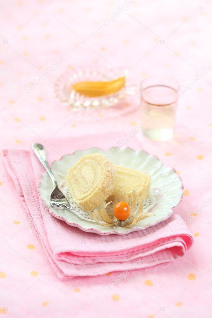 Two Pieces Of Tropical Swiss Roll Cake With Mango Cream Cheese Filling
