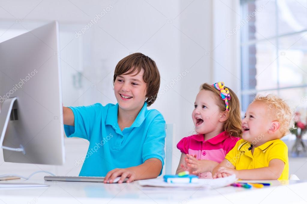 Kids doing homework with modern computer — Stock Photo © FamVeldman ...