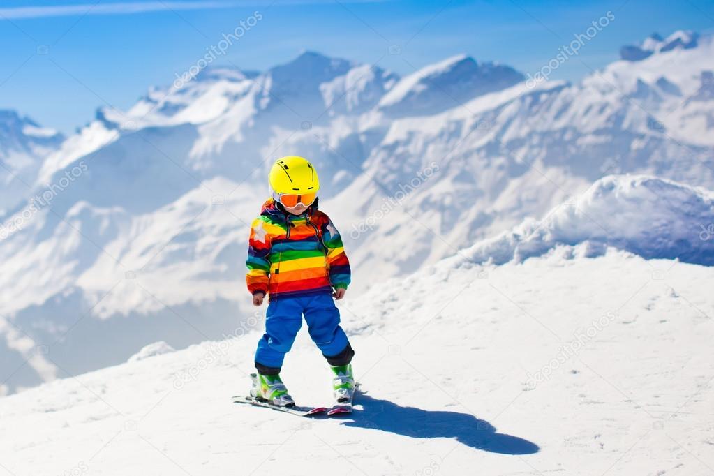 Little child skiing in the mountains Stock Photo by ©FamVeldman 124401122