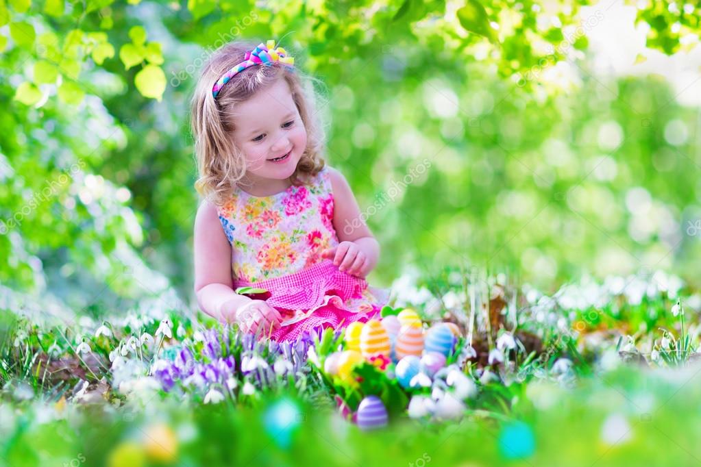 Little girl at egg hunt Stock Photo by ©FamVeldman 67380733