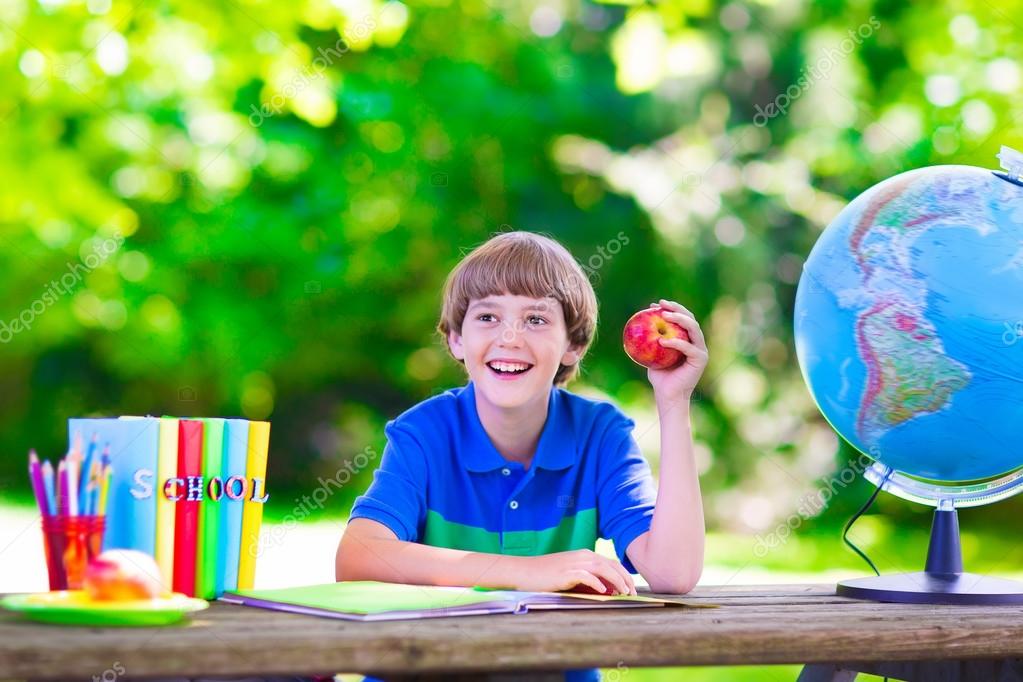 School boy doing homework — Stock Photo © FamVeldman #69957997