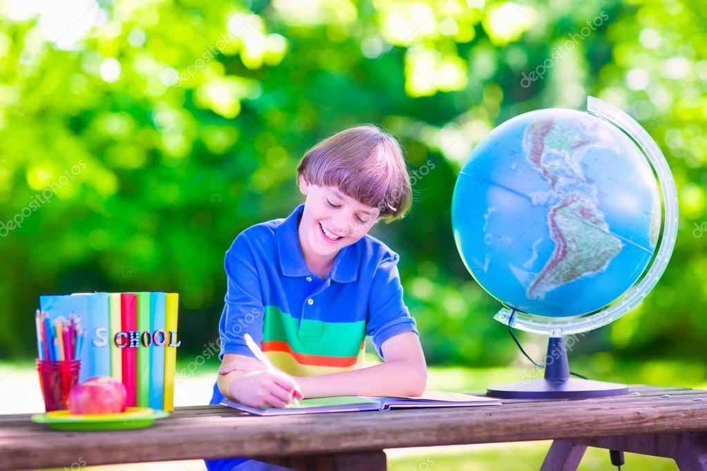 School boy doing homework in school yard — Stock Photo © FamVeldman ...