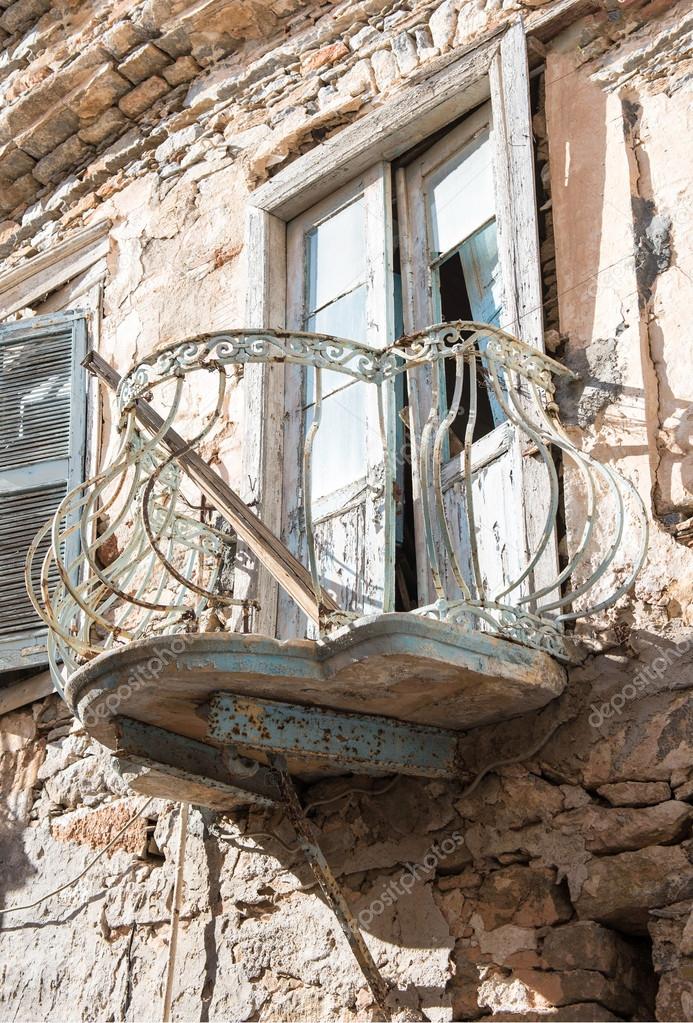 Old destroyed balcony — Stock Photo © GiannikosImages #99970866