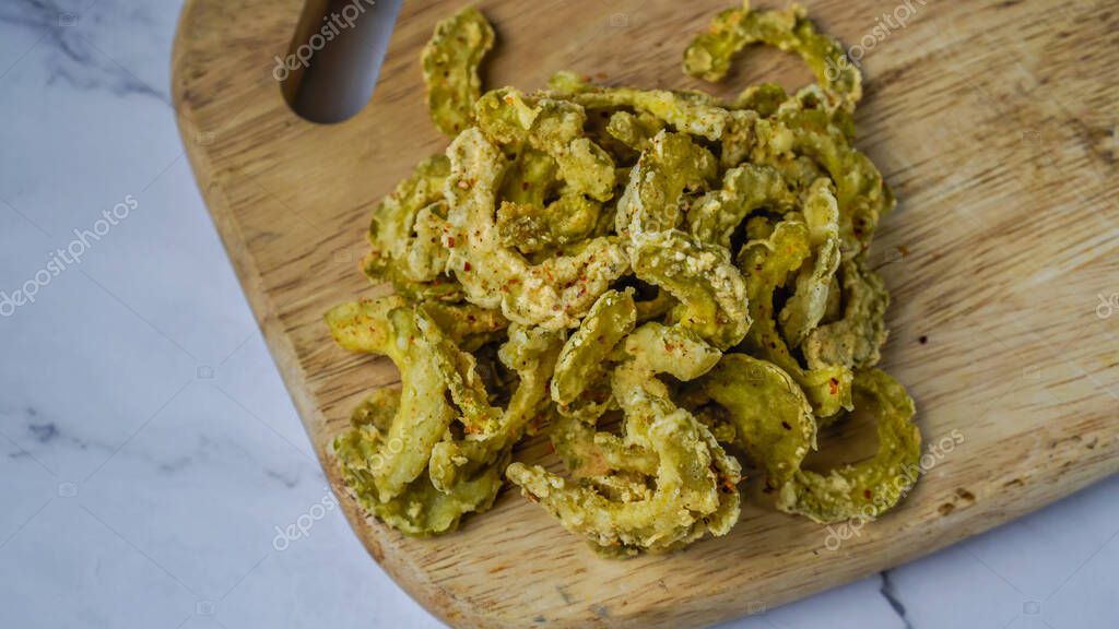 Melón crujiente frito y amargo con hojuelas de chile. Deliciosos ...
