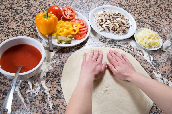 Baker Flattening Dough With Hands And Preparing It For Making Vegetable ...