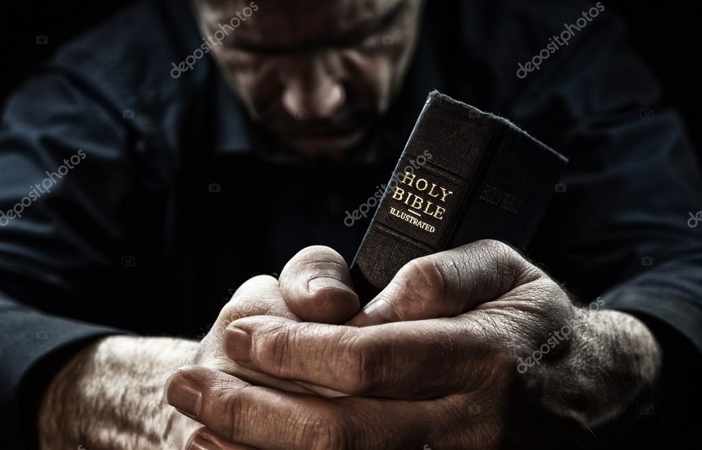 Man And Woman Holding Bible