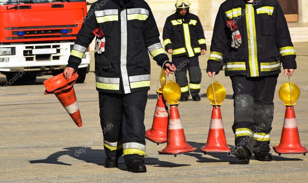 Firefighters with traffic cones — Stock Photo © majorosl66 #68952325