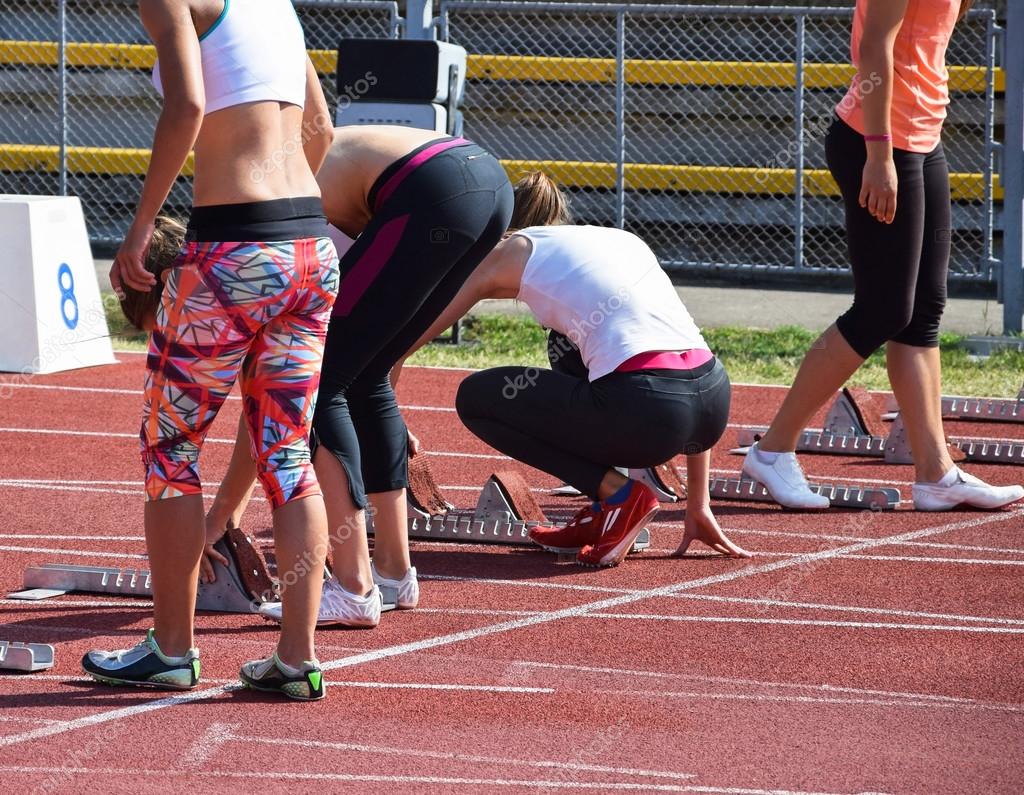 Runners on the running track Stock Photo by ©majorosl66 69186159