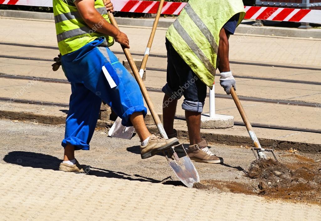 Men are working at the road construction — Stock Photo © majorosl66 ...