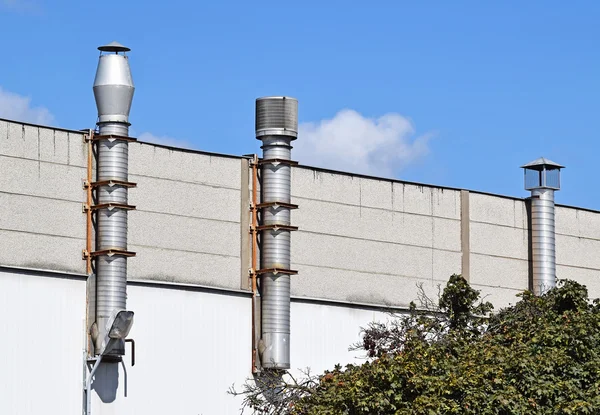 Metal smoke stacks of a factory - Stock Image - Everypixel