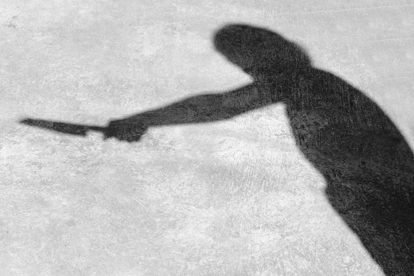 Shadow man raised a knife to stab Stock Photo by ©Gap 113209604