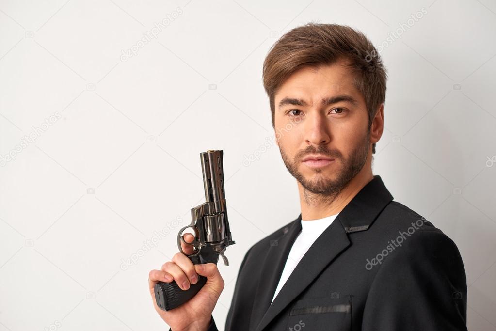 Man Holding Gun Stock Man Holding Gun Stock