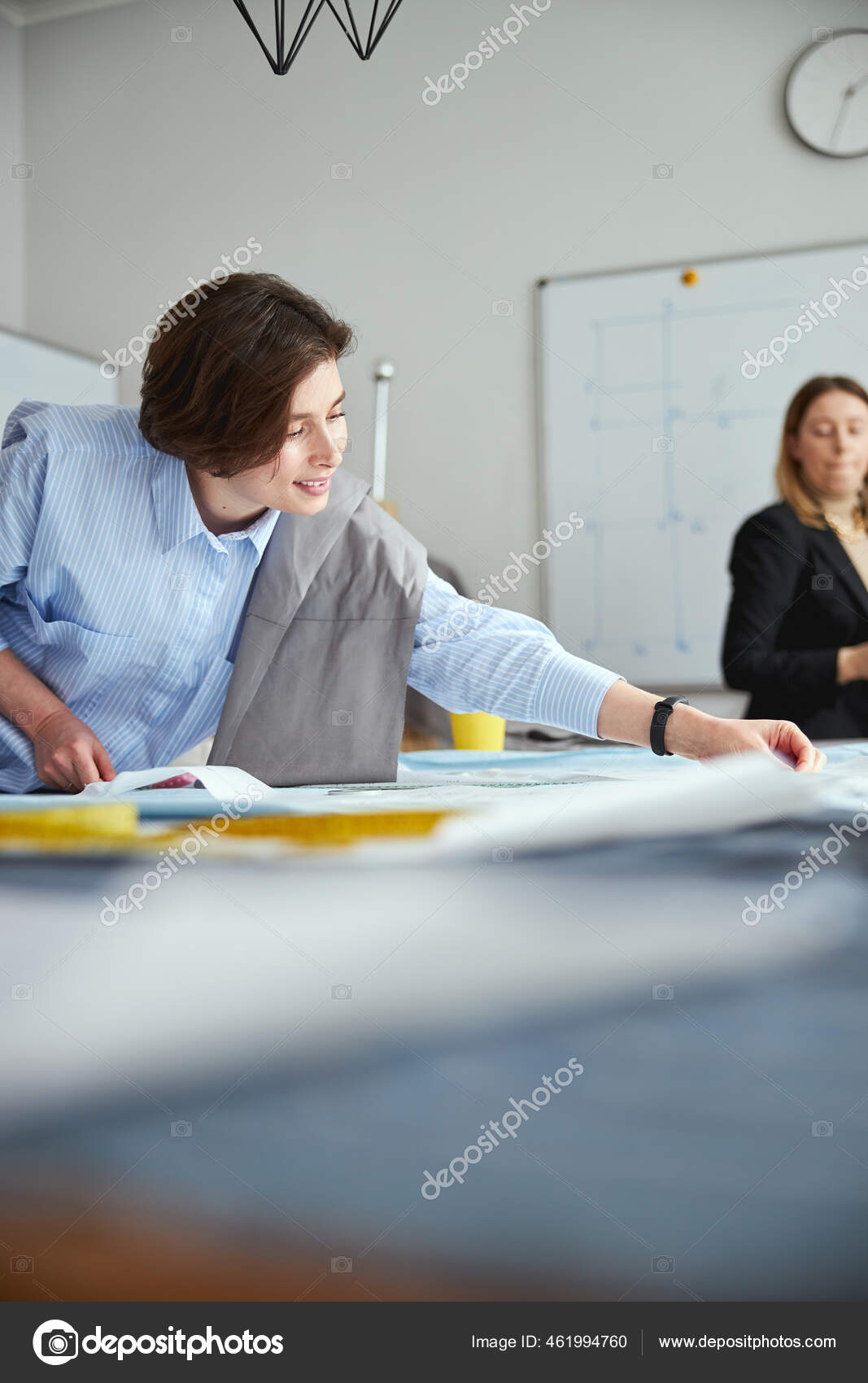 Female clothes design student using tape measure Stock Photo by ...