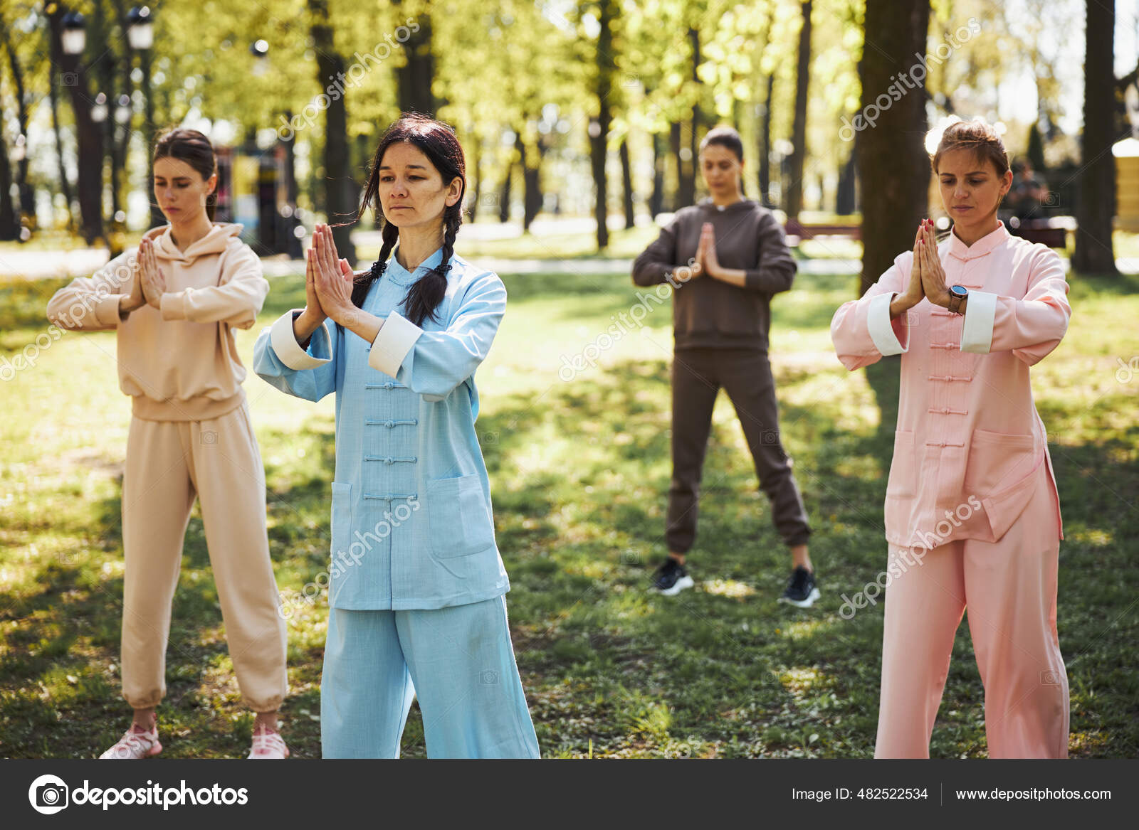 Praying pose, performed by group of tai chi learners — Stock Photo ...