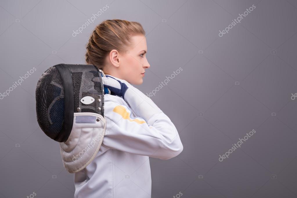Young woman engaging in fencing Stock Photo by ©yacobchuk1 54824385