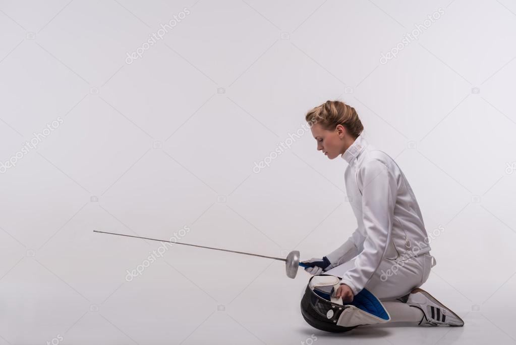Young woman engaging in fencing Stock Photo by ©yacobchuk1 55294905