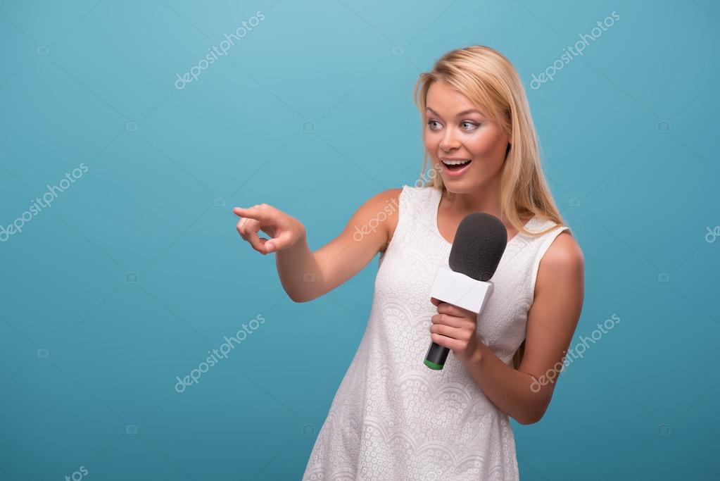 Very beautiful TV presenter Stock Photo by ©yacobchuk1 55369619