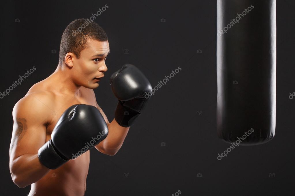 Handsome boxer on the workout Stock Photo by ©yacobchuk1 63710007