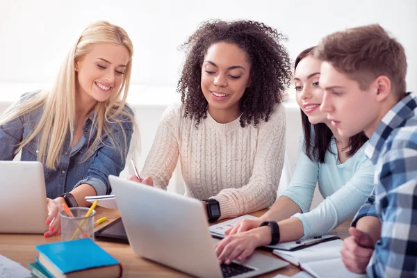 Group of young and content students using modern technologies - Stock ...