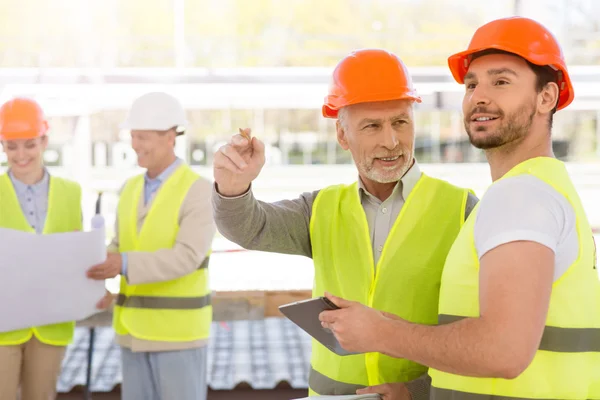 Construction workers. Team of project — Stock Photo © Dmyrto_Z #111727036