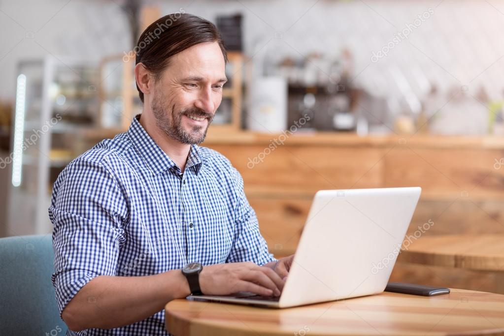Handsome man using computer — Stock Photo © Dmyrto_Z #123895530