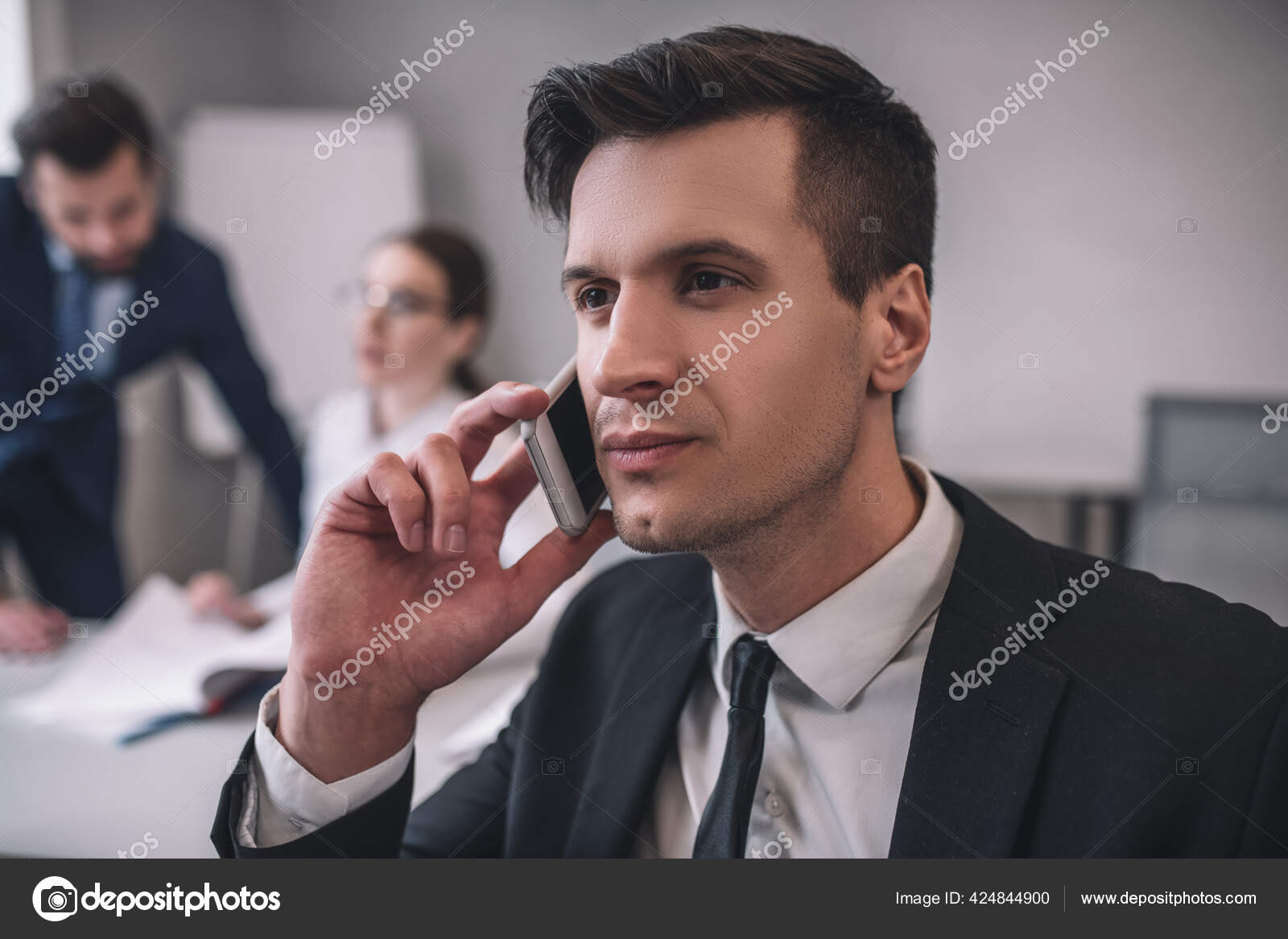 Close business mans face while talking on smartphone Stock Photo by ...