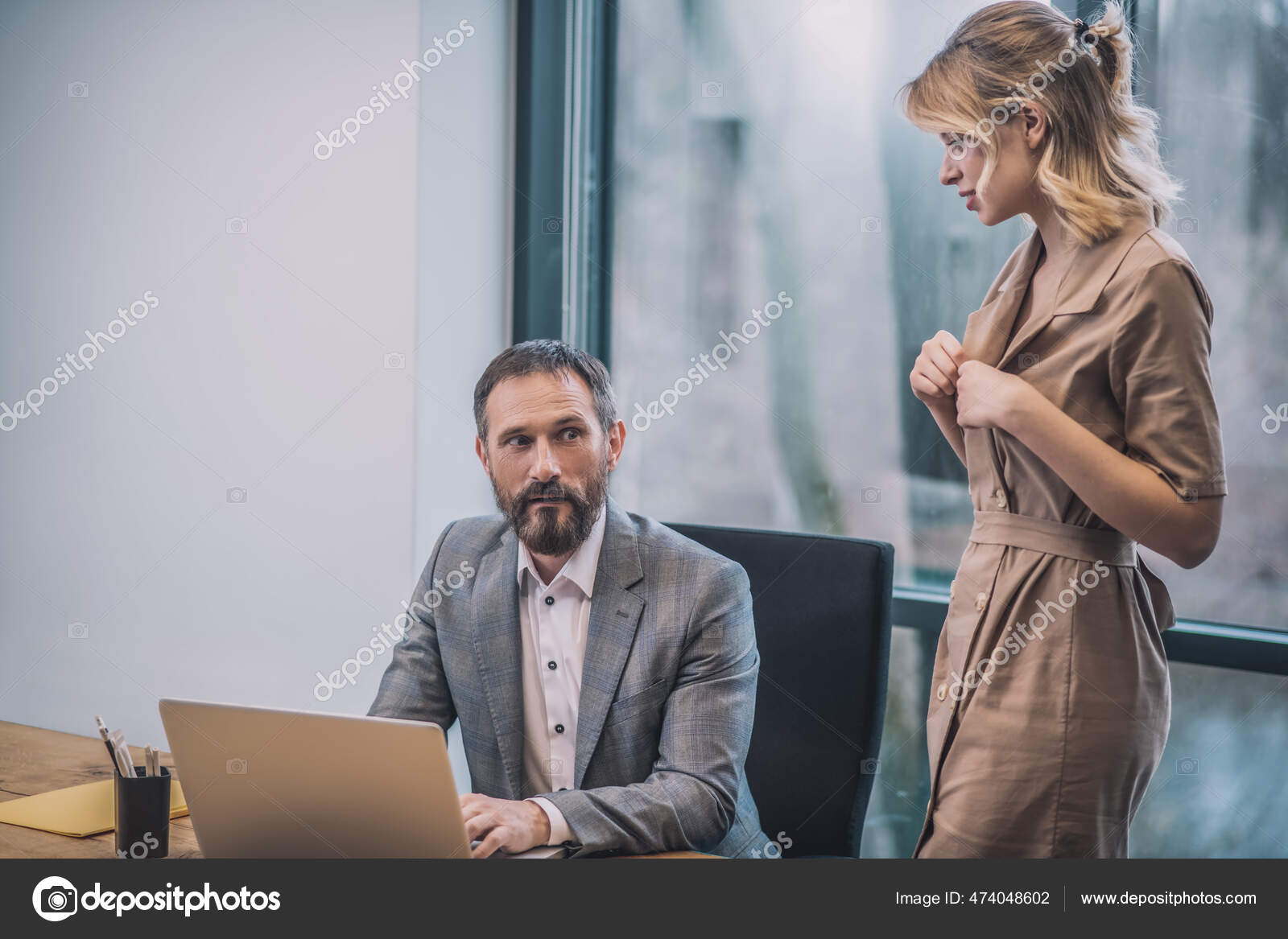Scared boss and flirting young woman assistant — Stock Photo © Dmyrto_Z ...