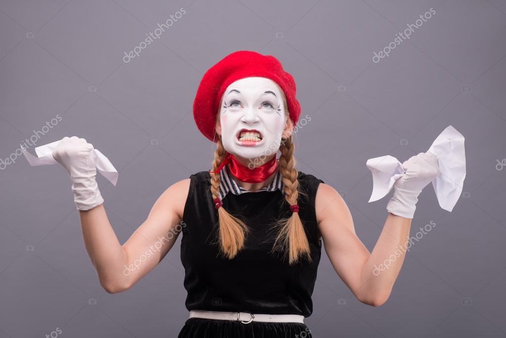 Female mime angry crumpling a paper — Stock Photo © Dmyrto_Z #53023447