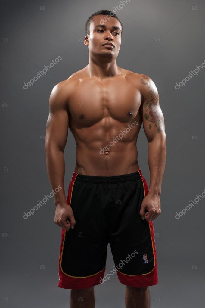 Young handsome African man posing shirtless — Stock Photo © Dmyrto_Z ...