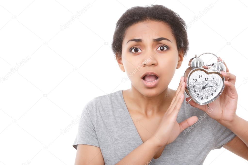 Young mulatto girl posing with alarm clock Stock Photo by ©Dmyrto_Z ...