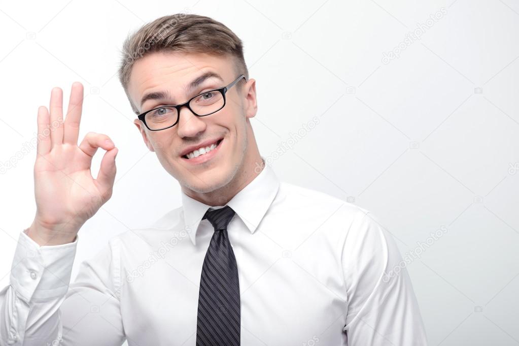 Smiling businessman pointing ok with his fingers — Stock Photo © Dmyrto ...