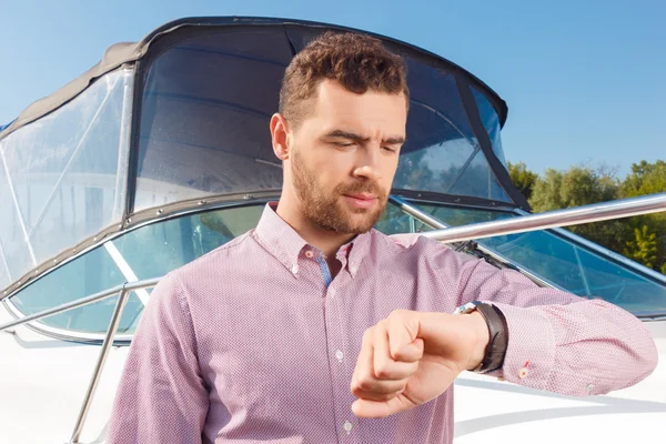 Handsome man watching time - Stock Image - Everypixel