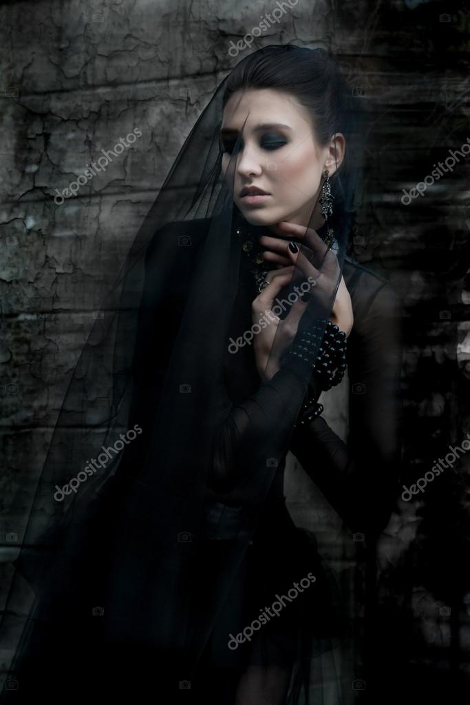 Fashiom model dressed in gothic style. Vamp. Stock Photo by ©jutar 79892252