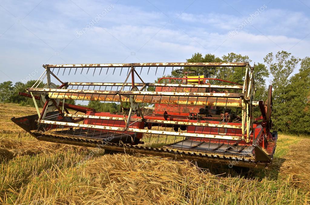 Old grain swather in wheat field — Stock Photo © fiskness #103830246