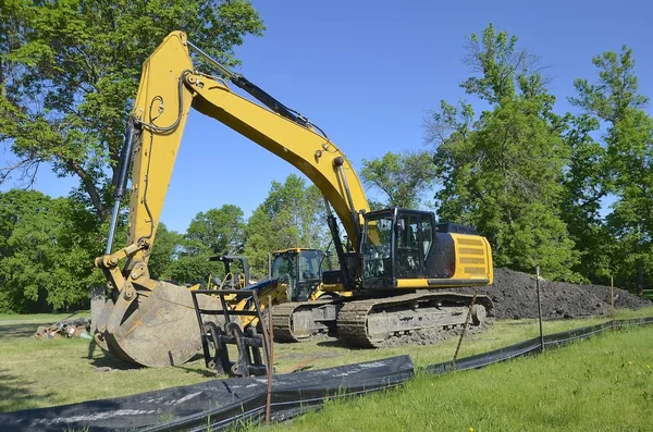 Excavating machine moving earth — Stock Photo © fiskness #157539186