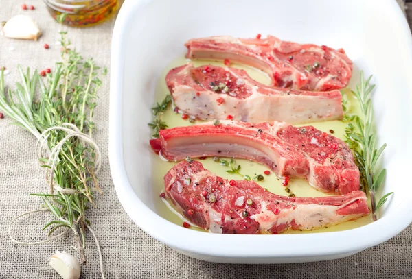 Raw meat, mutton, lamb rack with marinated - Stock Image - Everypixel