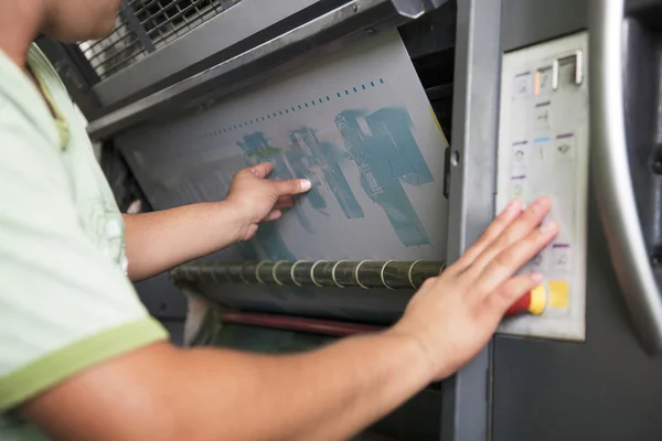 Sheet pulled from printing press — Stock Photo © camaralenta #76730957