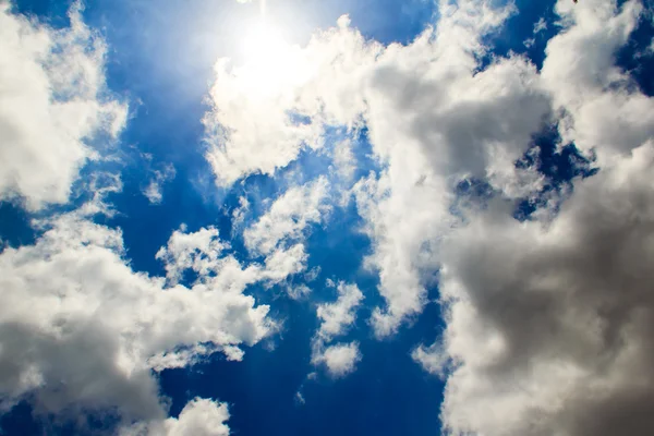 Bright clouds with blue sky ,sun rays - Stock Image - Everypixel