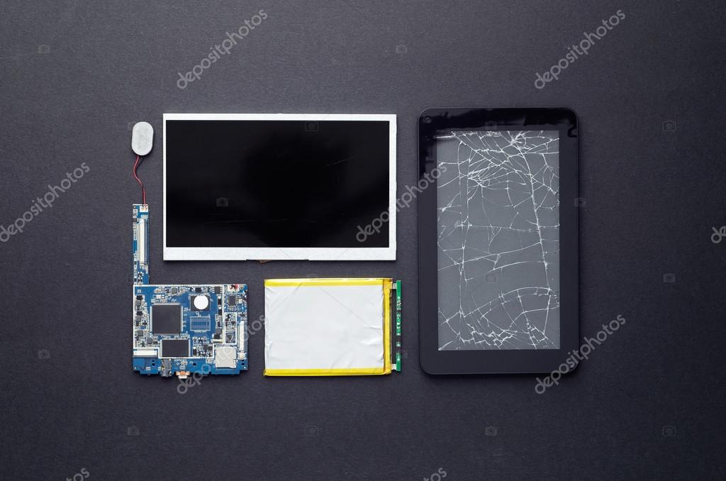 Components of a broken tablet Stock Photo by ©bogdandreava 117421448