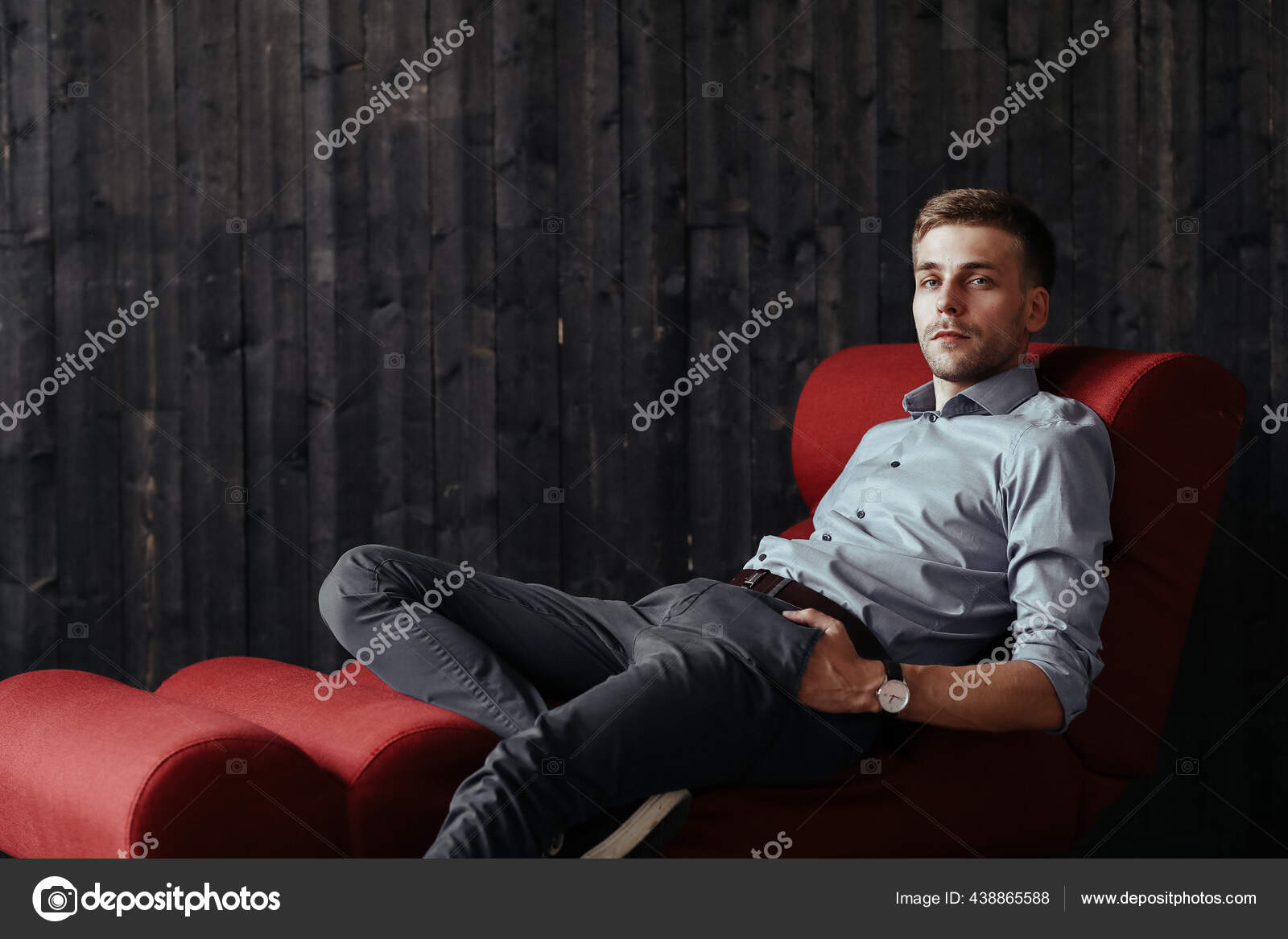 Handsome Man Wooden Wall Background Stock Photo by ©racool_studio 438865588