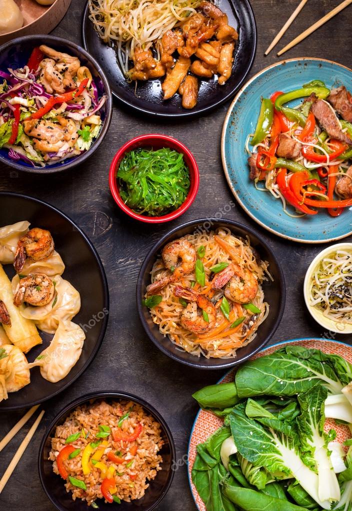 Chinese food on a dark table — Stock Photo © somegirl #119555648