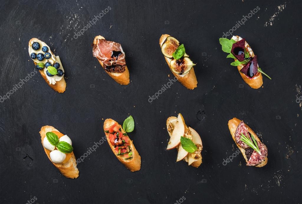 Italian crostini with various toppings Stock Photo by ©sonyakamoz 120363406