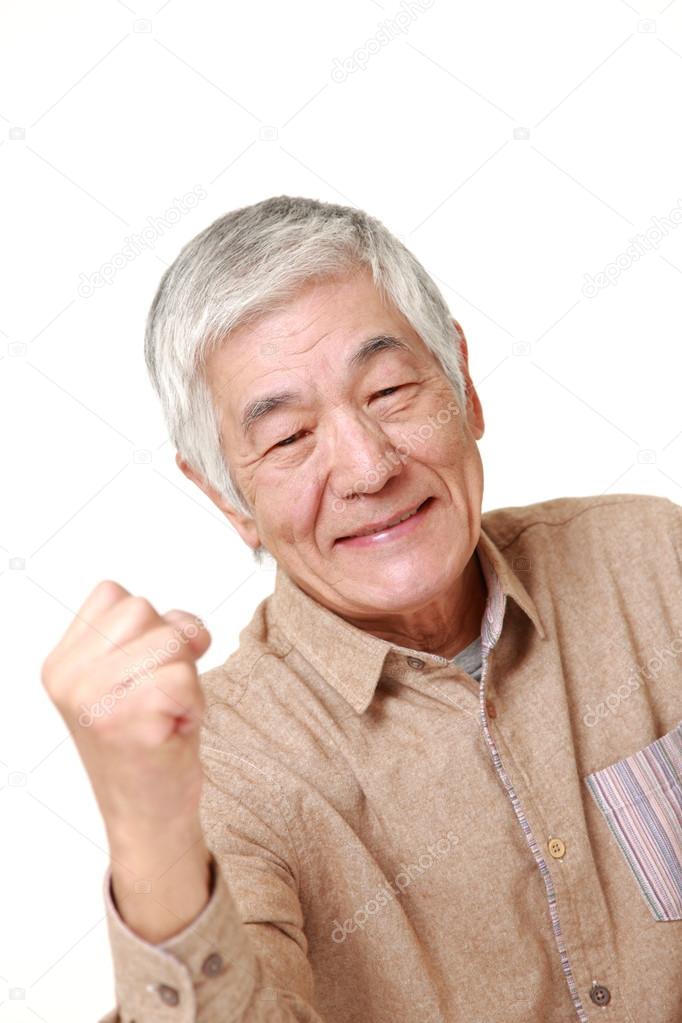 Senior Japanese man in a victory pose Stock Photo by ©deeblue 111505134