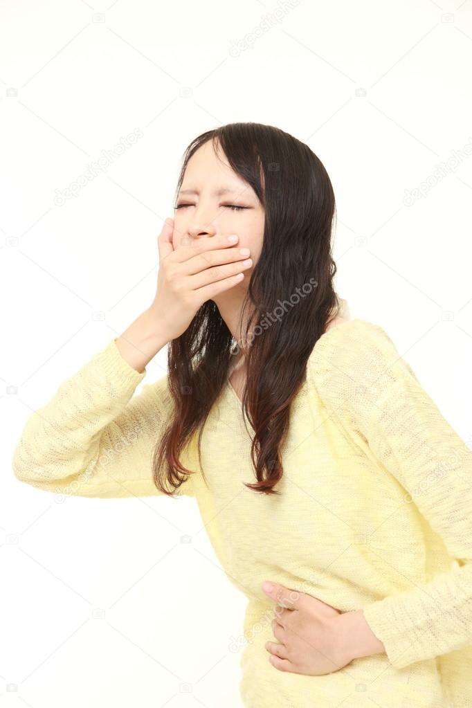 Young Japanese woman feels like vomiting — Stock Photo © deeblue #118633206