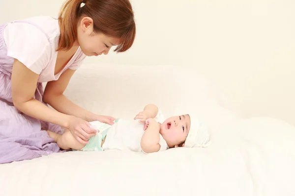 Diaper change — Stock Photo © deeblue #56885863