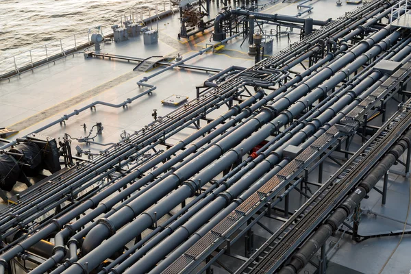 Cargo line of oil tanker Stock Photo by ©AnaolyMenzhiliy 107047990