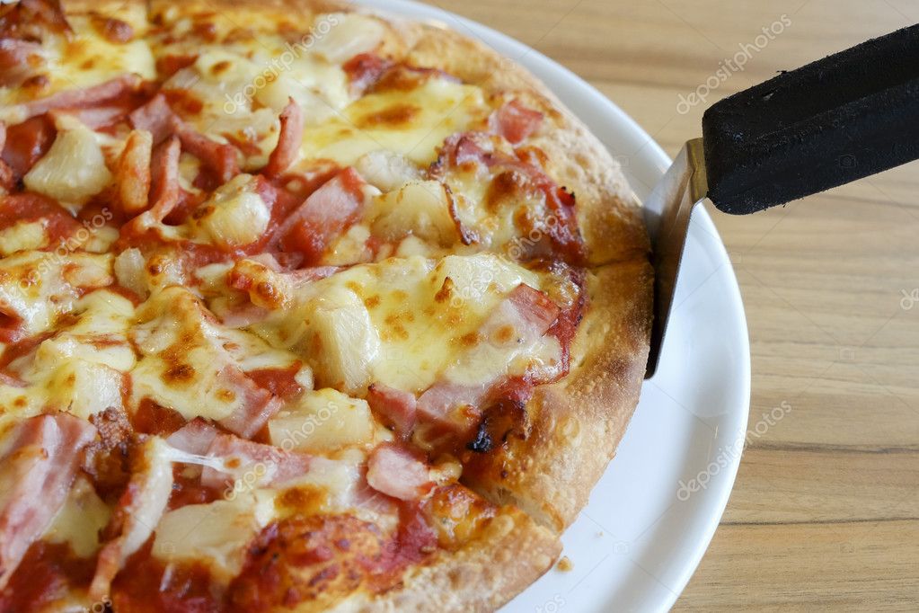 Delicious hawaiian rustic style pizza made with fresh pineapples Stock ...