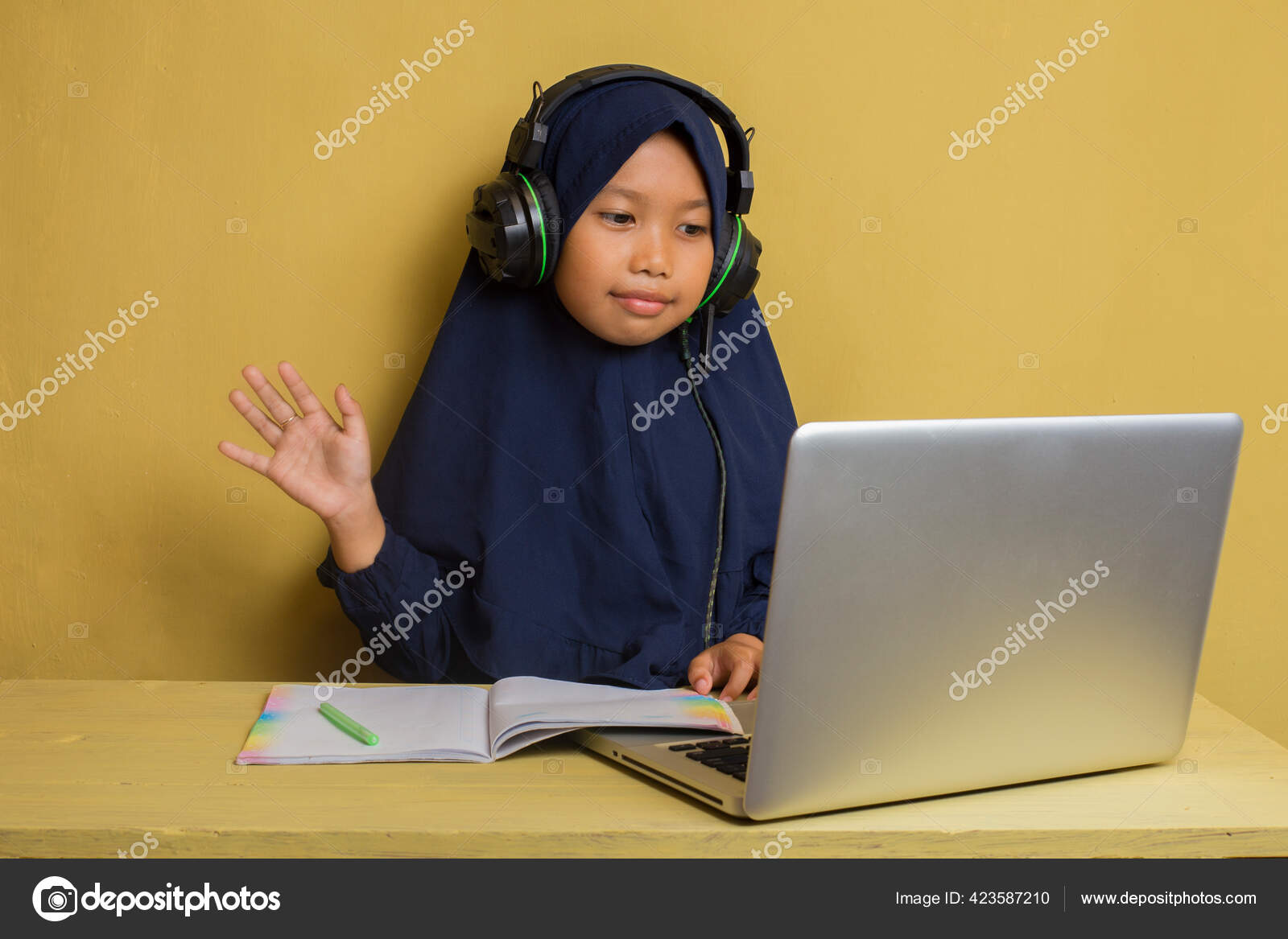 Little Asian Muslim Hijab Girl Using Her Laptop Computer Online Stock ...