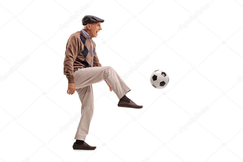 Joyful senior man kicking a football Stock Photo by ©ljsphotography ...